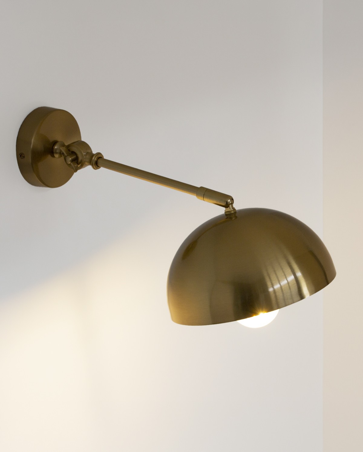 Kaia wall light in brushed gold finish metal