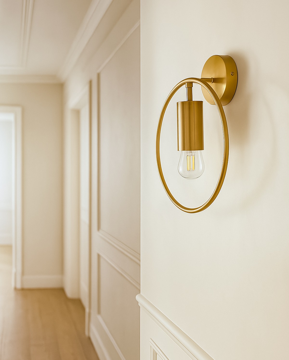 Thea wall light in brushed gold finish metal