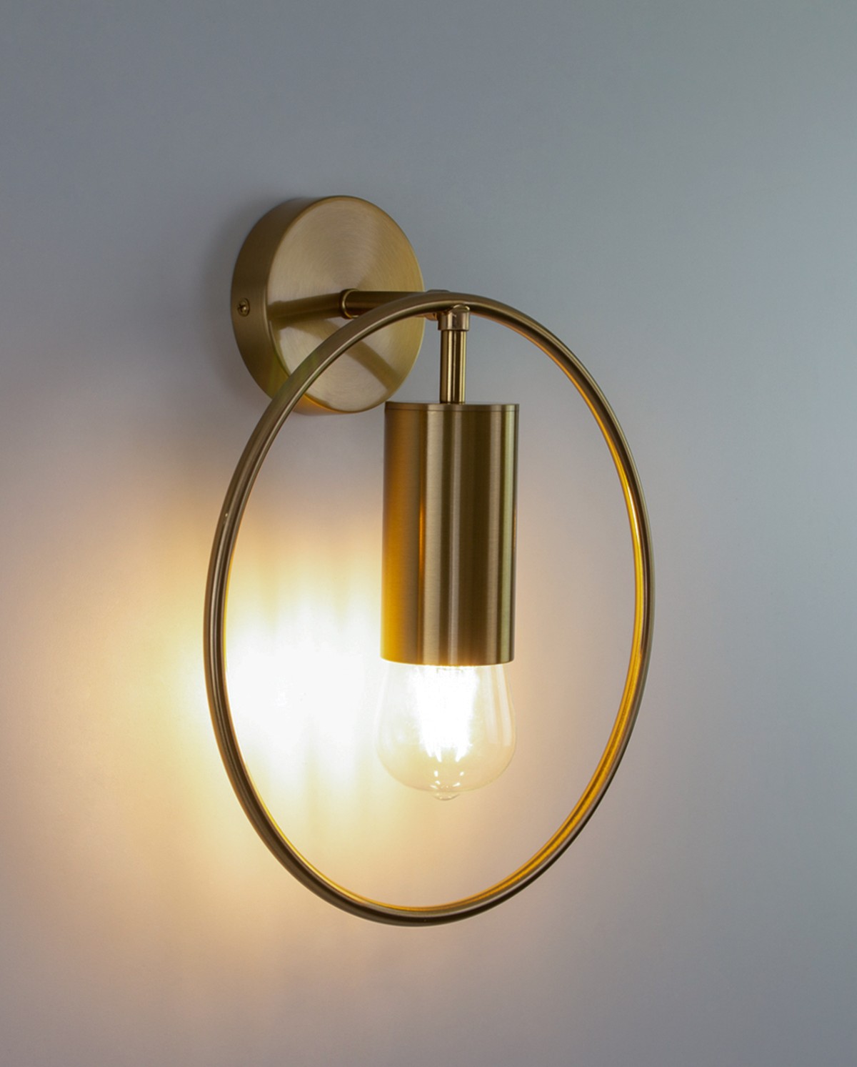 Thea wall light in brushed gold finish metal
